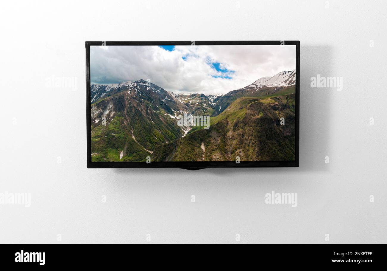 TV monitor on the wall Stock Photo - Alamy