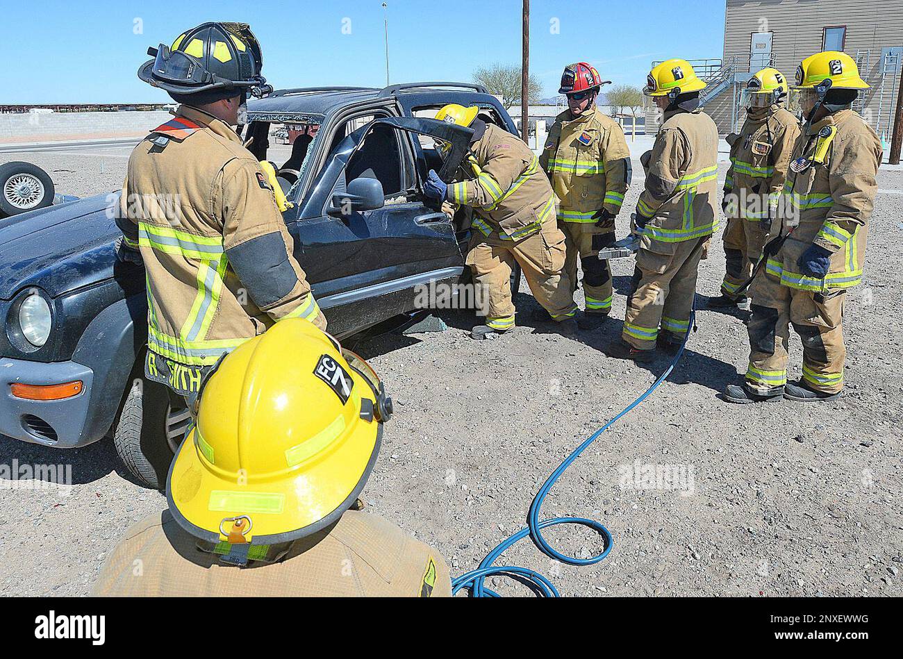 Yuma Fire Department Capt. Paul Evancho, fourth from right, watches as ...