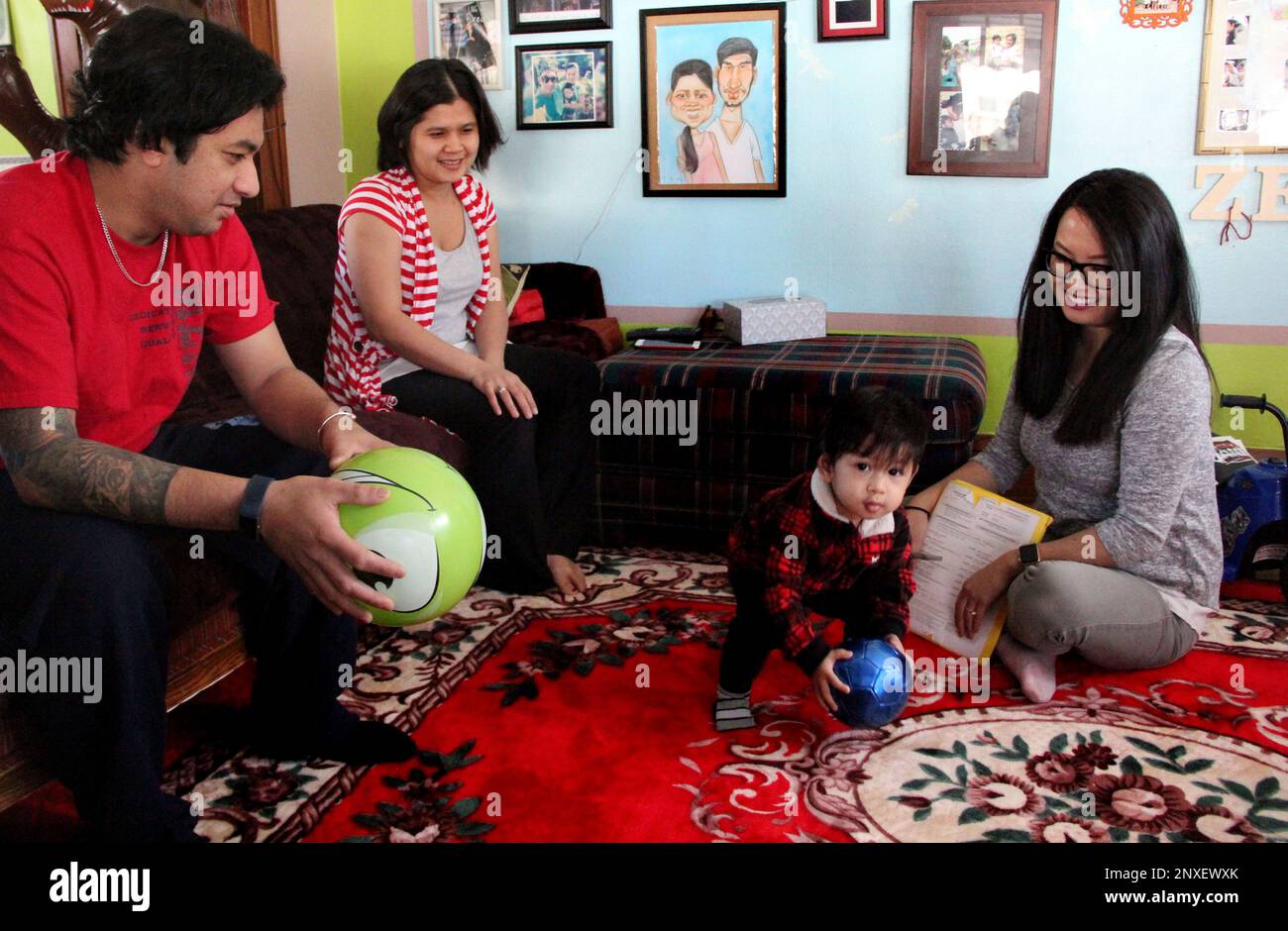 In this Feb. 16, 2018, photo, parents KP, left, and Zipora Niowong talk ...