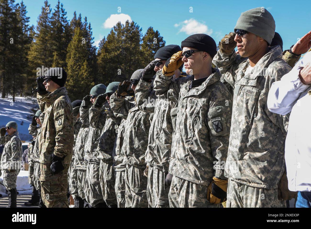 Colorado National Guard salute while the colors are presented during ...