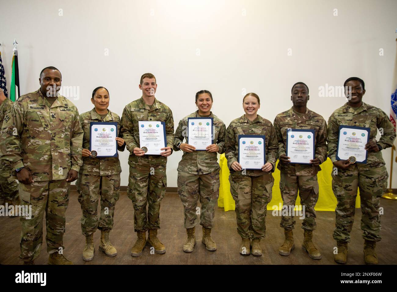 U.S. Army Soldiers pose with their Basic Leader Course certificate ...
