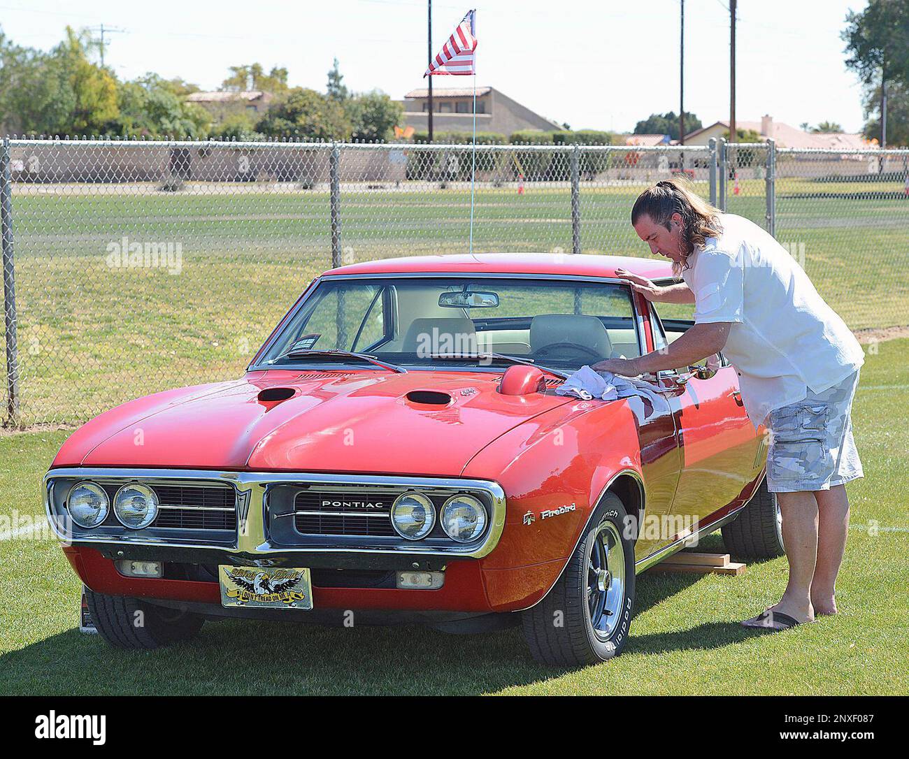 Jim Koch, from Chandler, puts a fresh coat of wax on his 1967 Pontiac ...