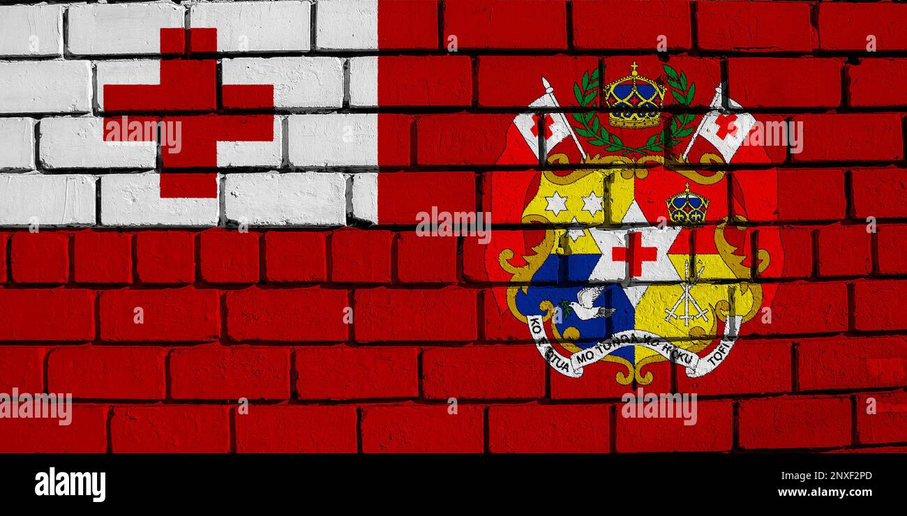 Flag and coat of arms of the Kingdom of Tonga on a textured background ...