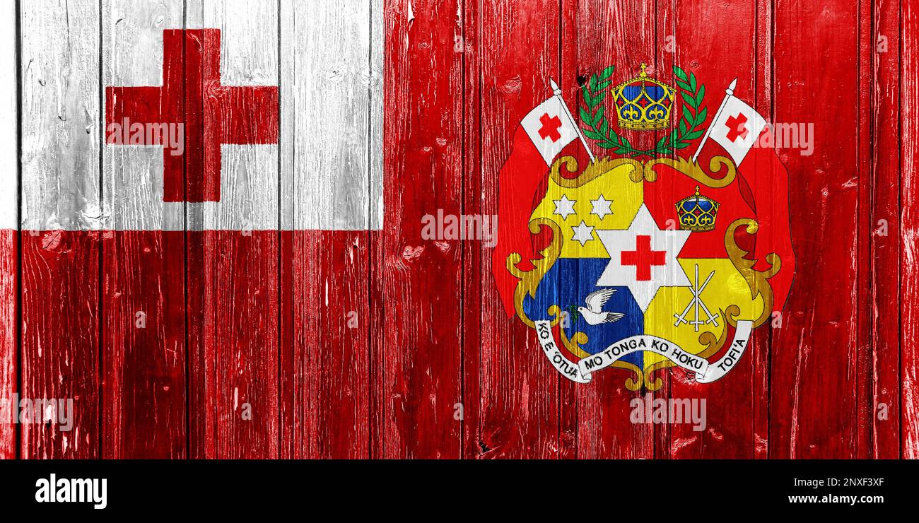 Flag and coat of arms of the Kingdom of Tonga on a textured background ...