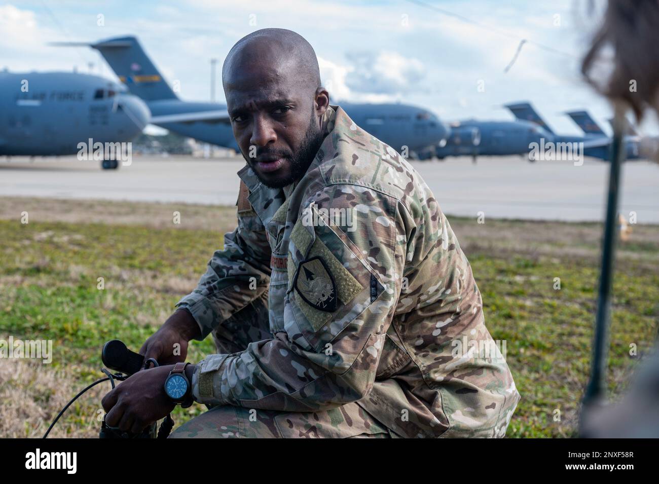 A U.S. Air Force Airman sets up a mobile communications antenna for a ...