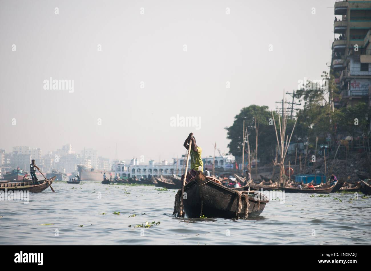 Picture of Boat on the water in Sadarghat and roadside view. Some ...