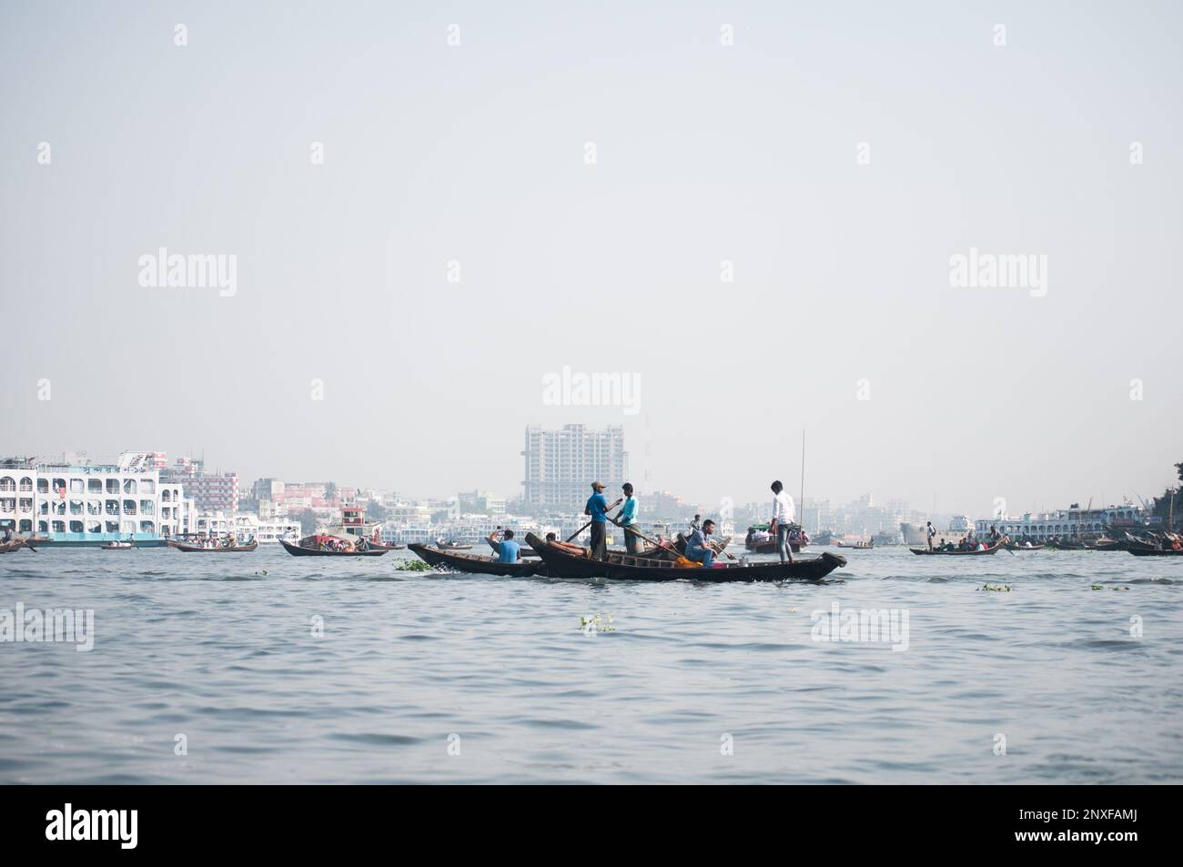 Picture of Boat on the water in Sadarghat and roadside view. Some ...