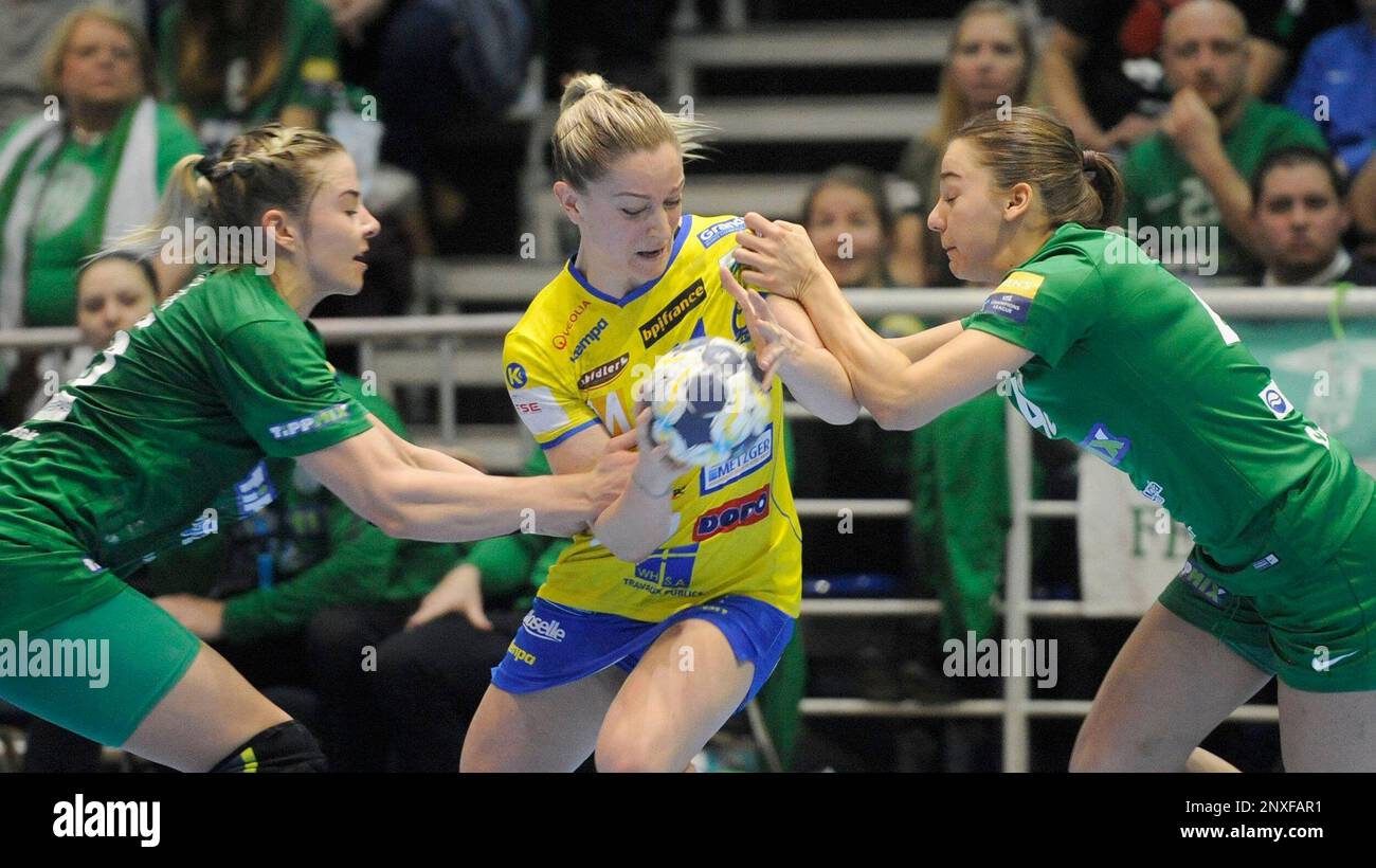 Manon Houette, center, of Metz of France is challenged for the ball by ...