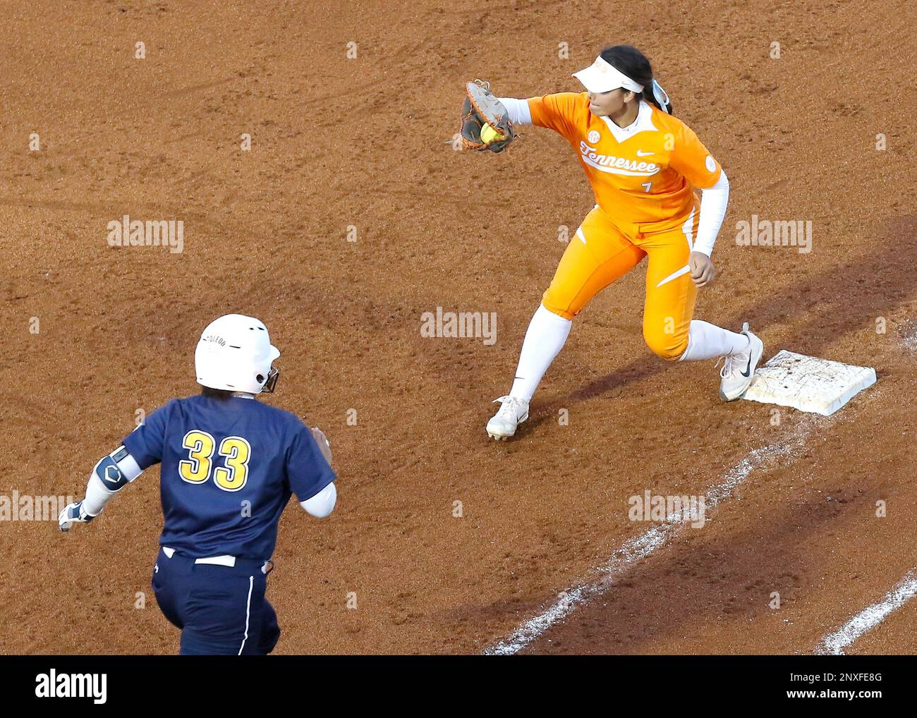 Tennessee's Ashley Morgan, right, takes the throw at first for the out ...