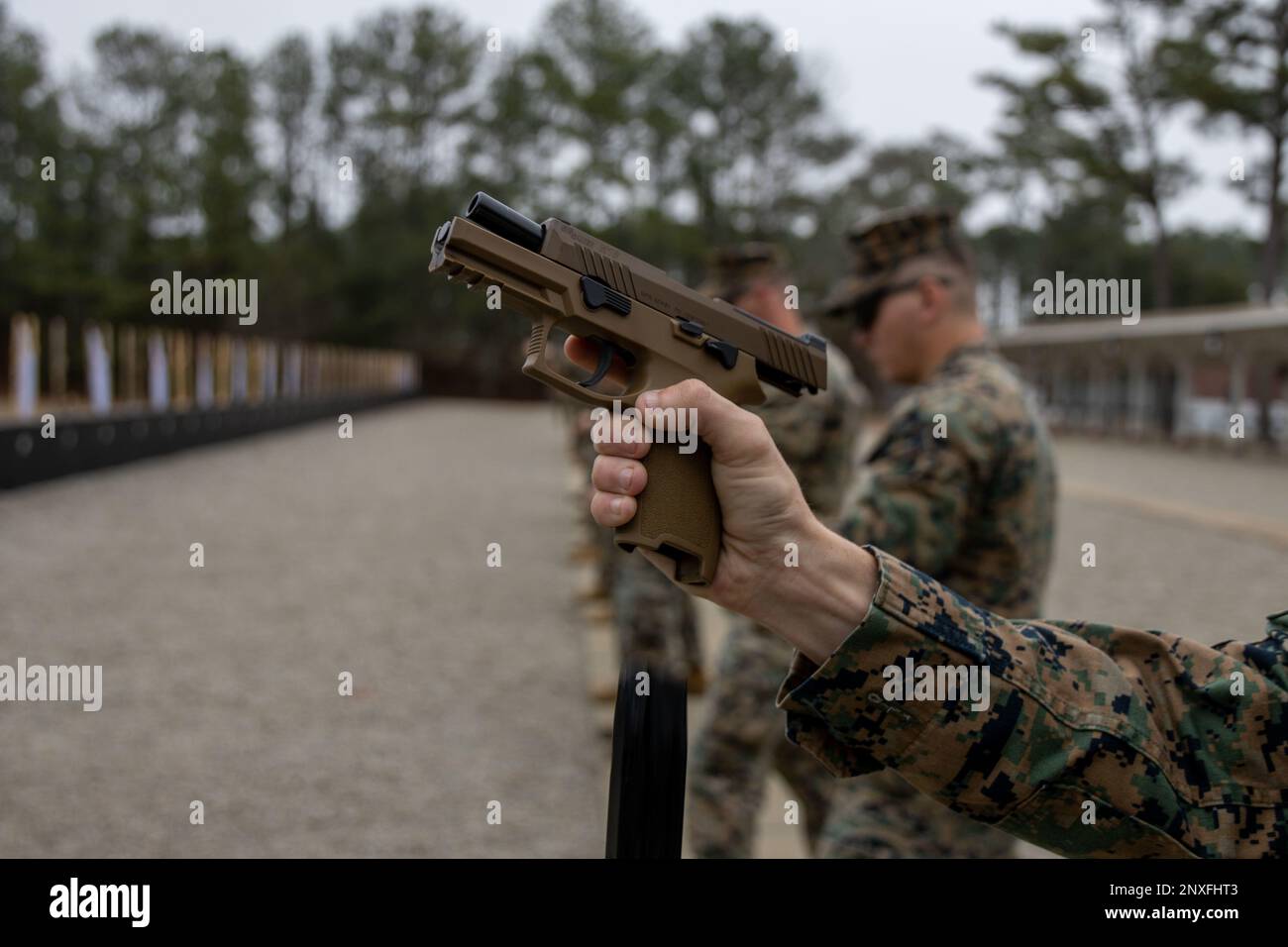 U.S. Marine Corps Cpl. Sam M. Fouts, a student with the School of ...
