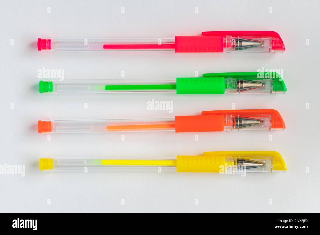 Colorful neon colors gel pens on white background Stock Photo - Alamy