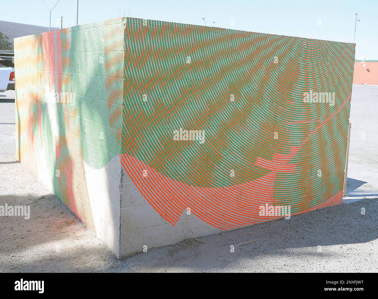 A two-sided mural by the artist MOMO decorates this trash enclosure at ...