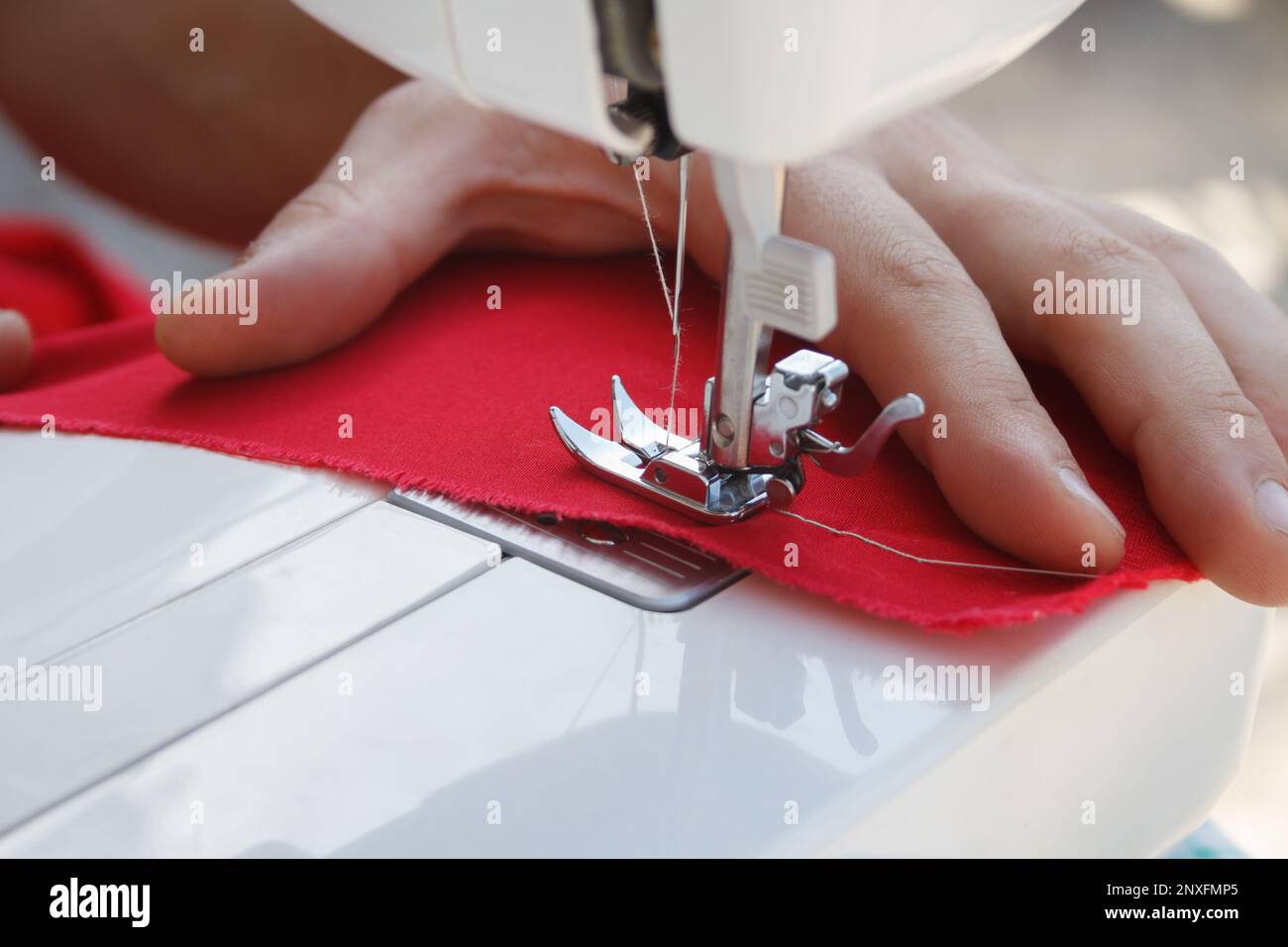 Sewer sews clothes on sewing hi-res stock photography and images - Alamy