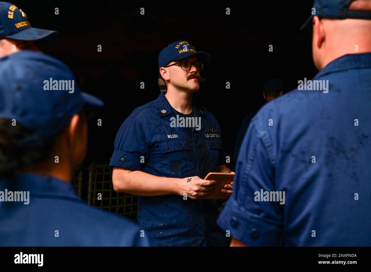 U.S. Coast Guard Petty Officer 2nd Class Daniel Wilson, a boatswain’s ...