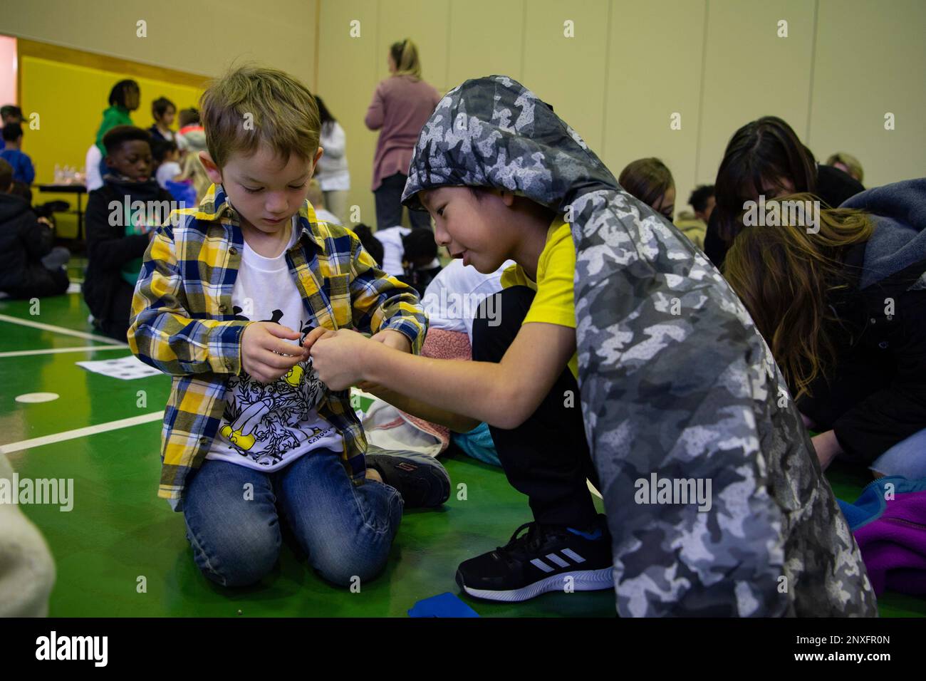 ZUSHI, Japan (February 16, 2023) - Students fold origami fireflies ...