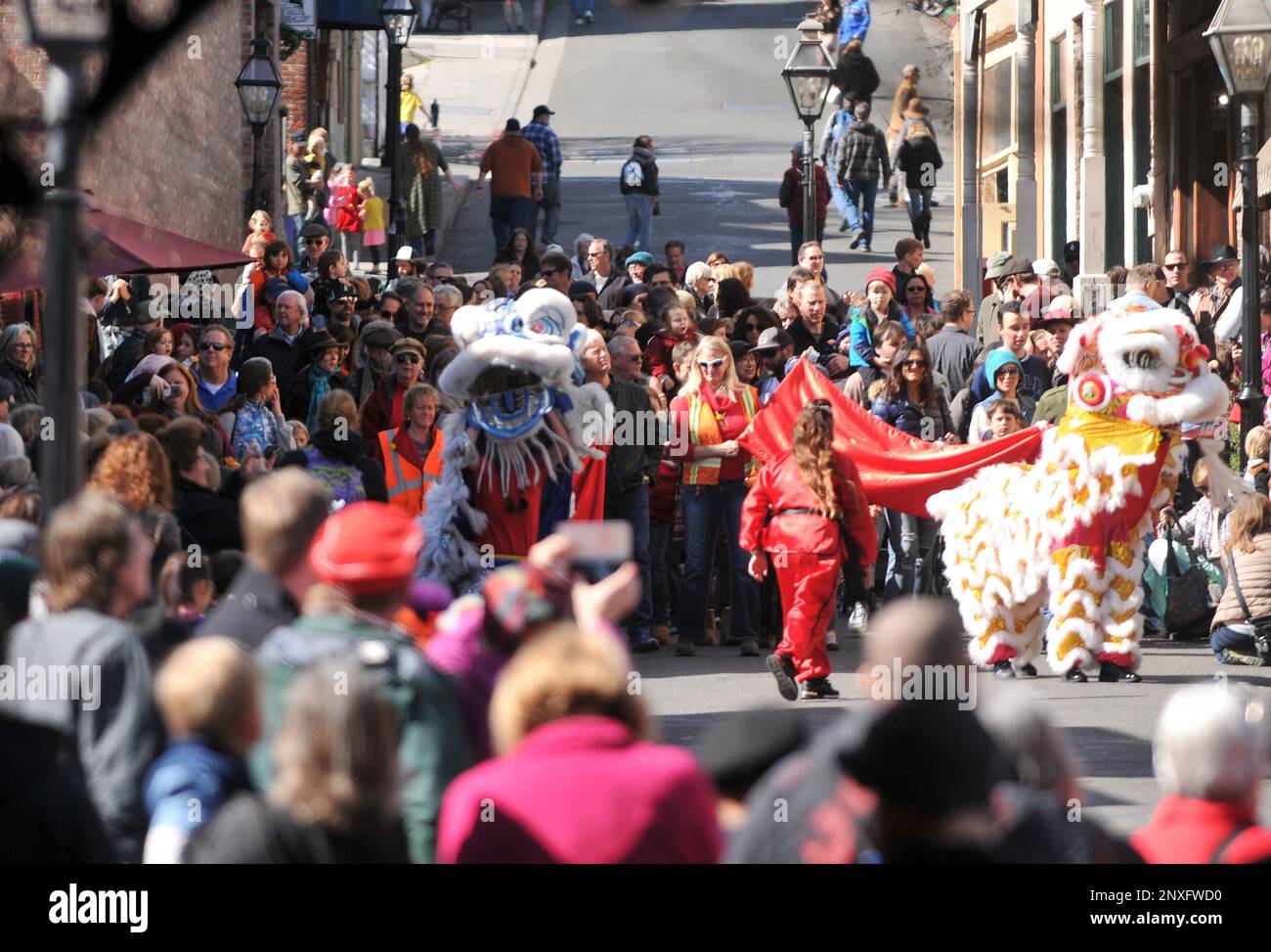Parade goers file in behind the final entrants of Sunday's Chinese New ...