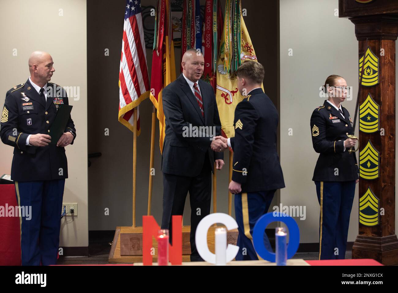Sgt. Coy Dobie, 3rd Battalion, 321st Field Artillery Regiment, shakes ...