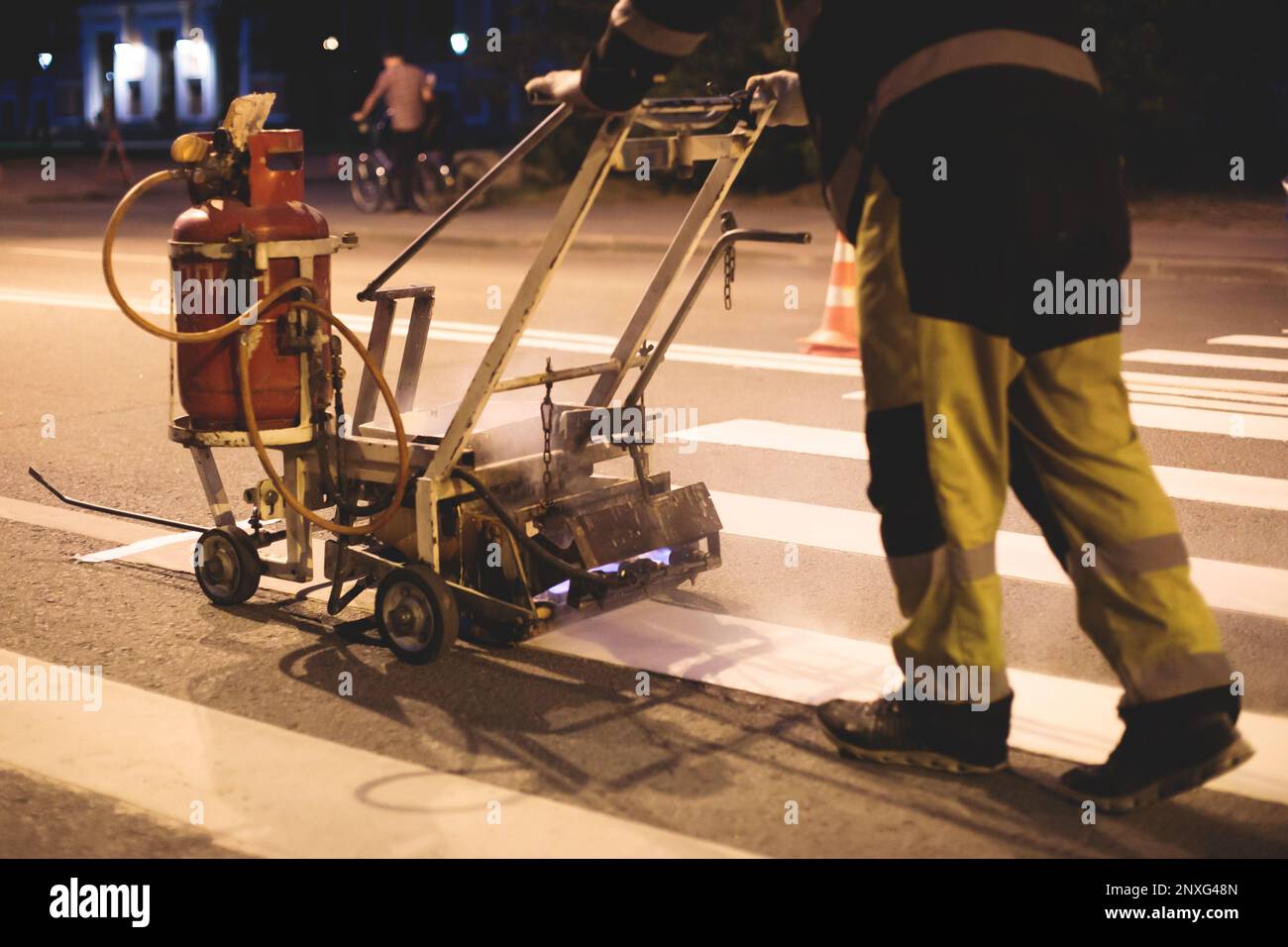 Process of making new road surface markings with a line striping ...