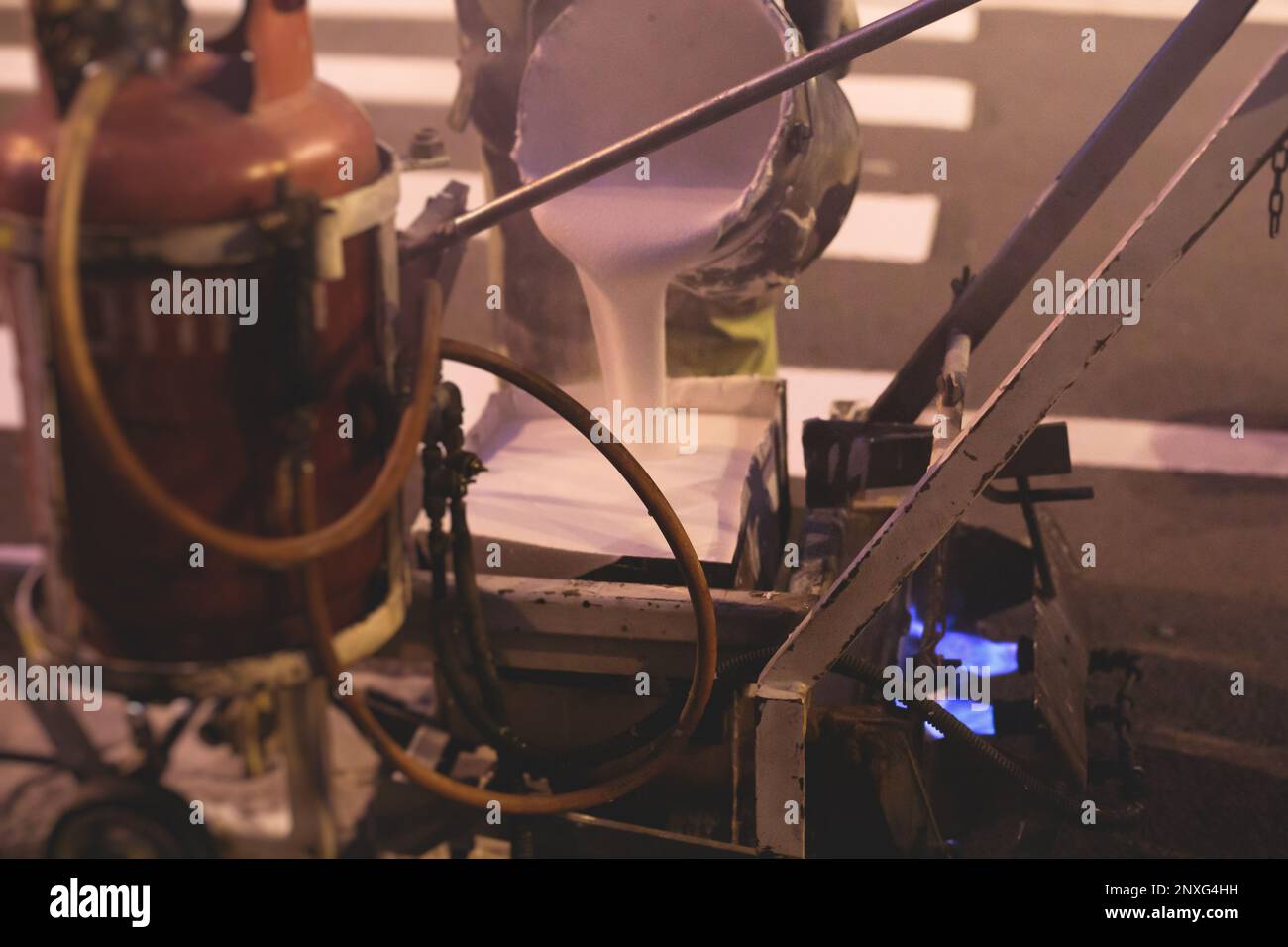 Process of making new road surface markings with a line striping ...