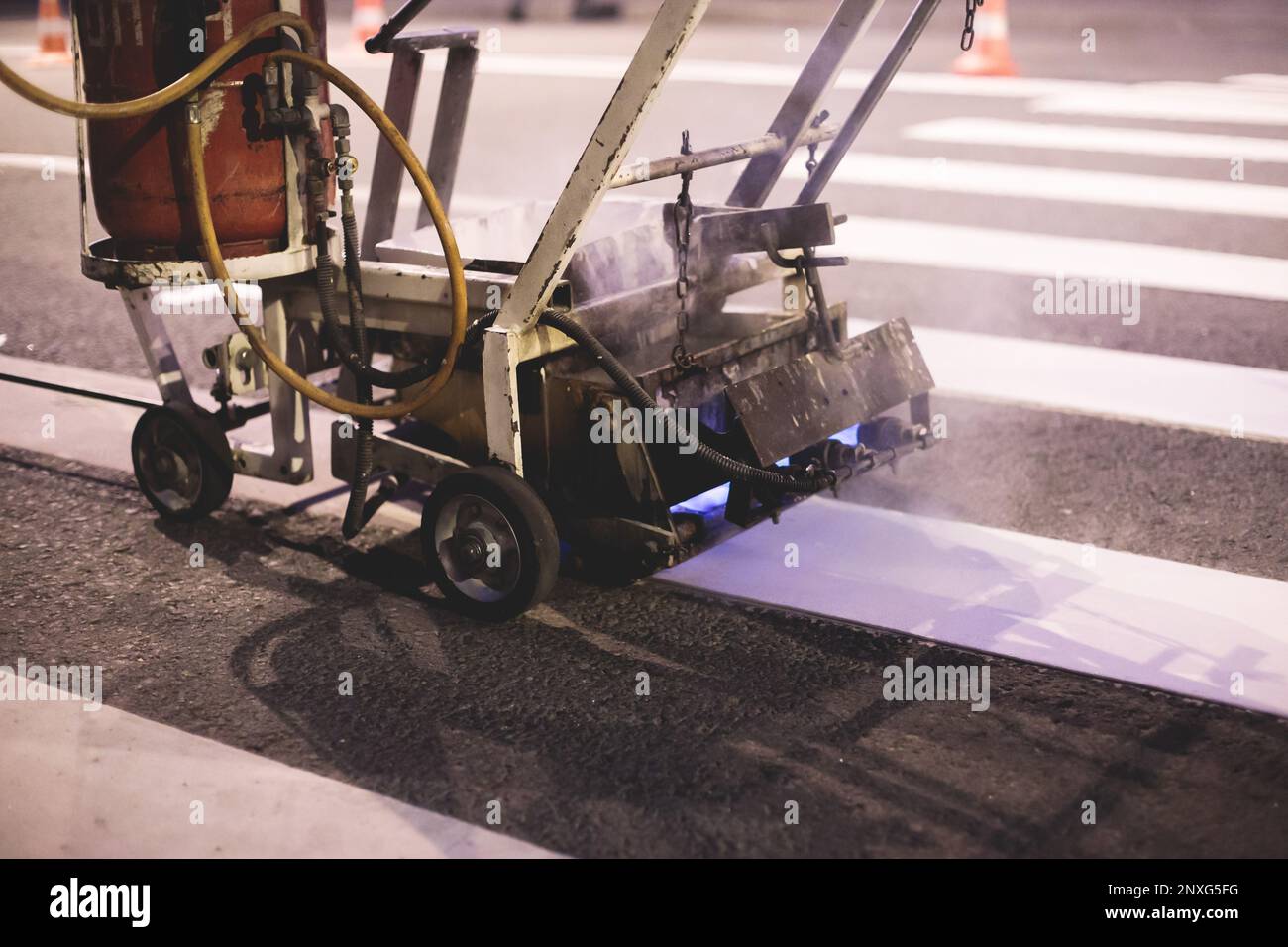 Process of making new road surface markings with a line striping ...