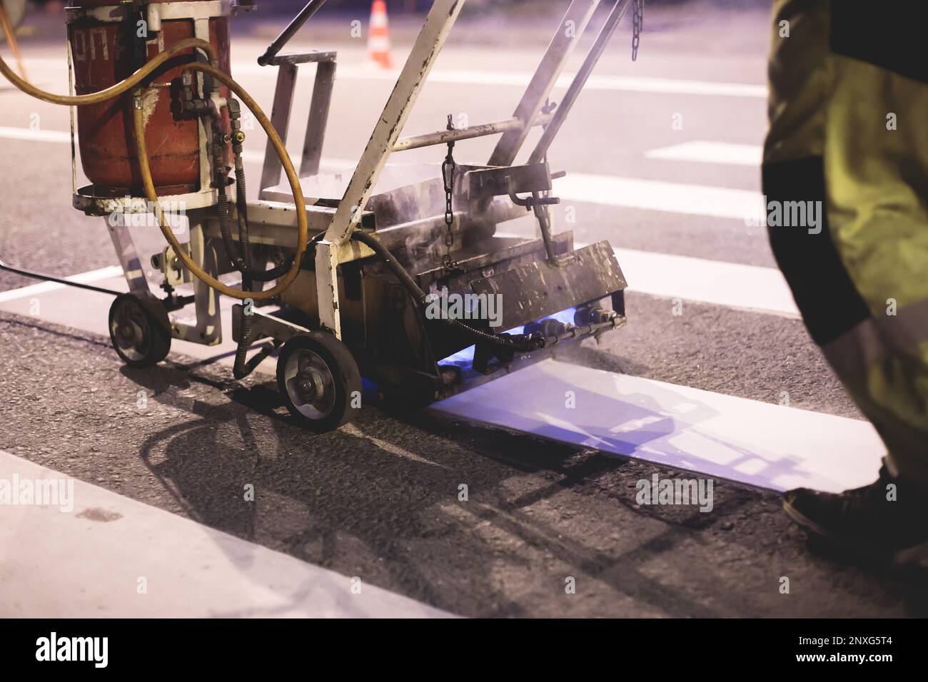 Process of making new road surface markings with a line striping ...