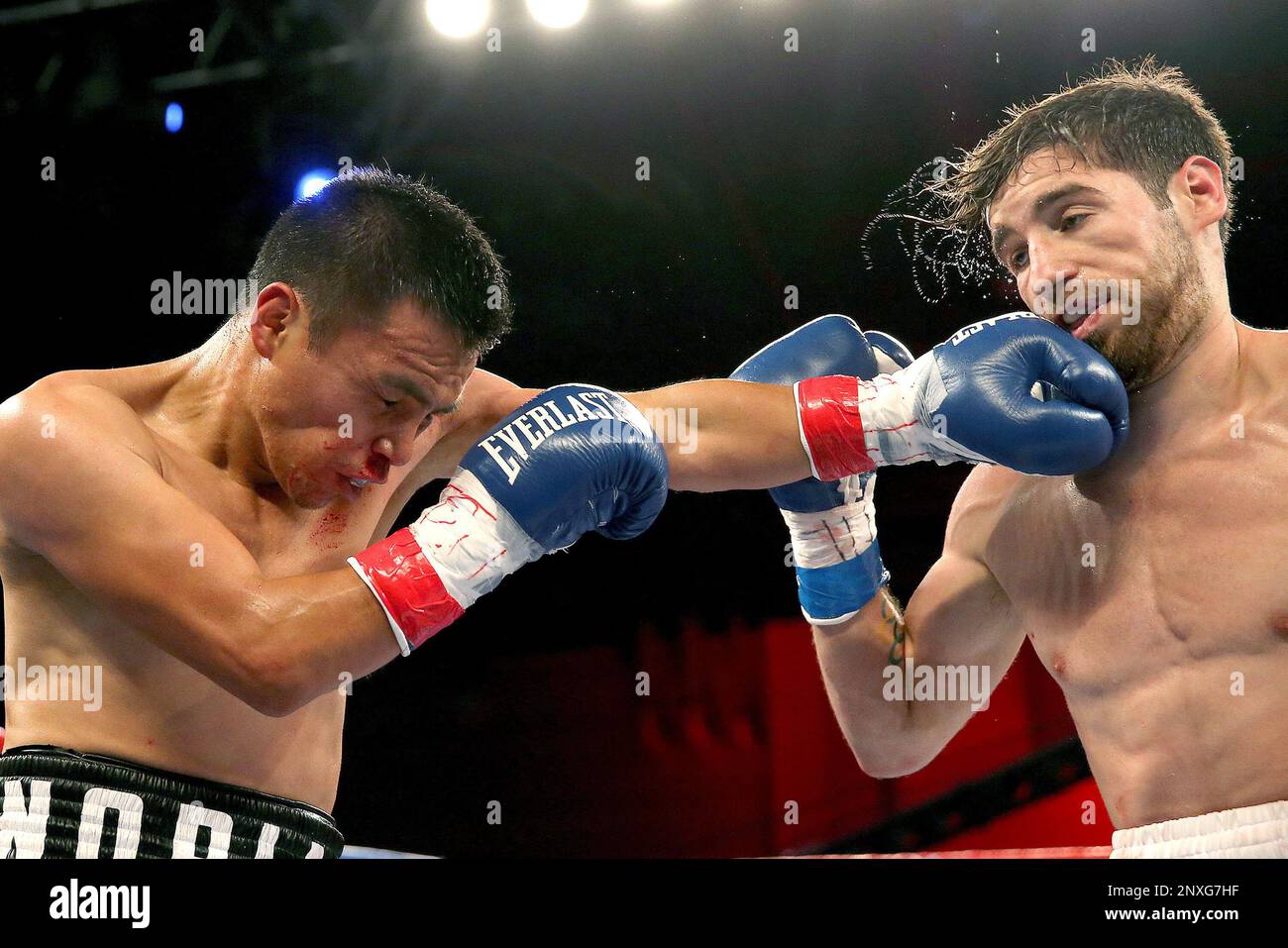 Puerto Rican Olymian Jeyvier Cintron (R) gets punched in the face by ...