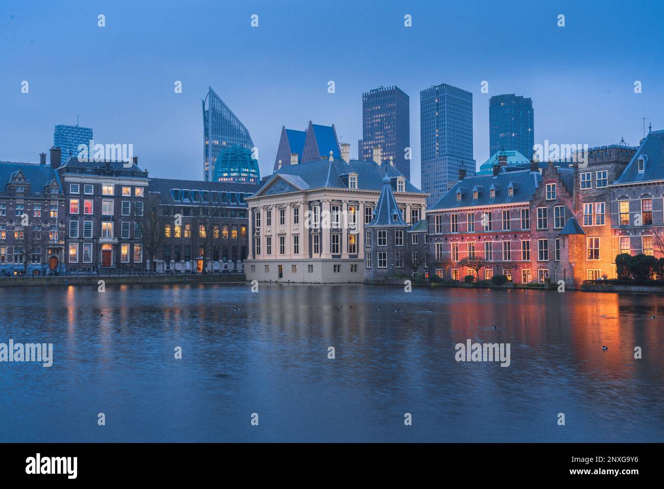 The Hague's Binnenhof with the Hofvijver lake and modern buildings at ...