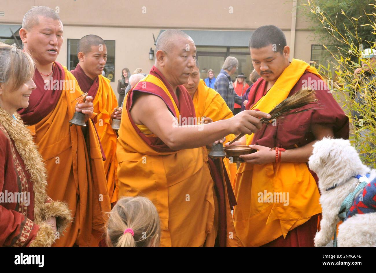 The monks use a peacocks feather, water, and a chant to administer the ...