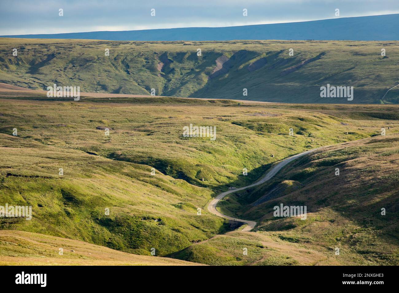 Looking across the Nent Valley to a winding track at Nenthead above the ...