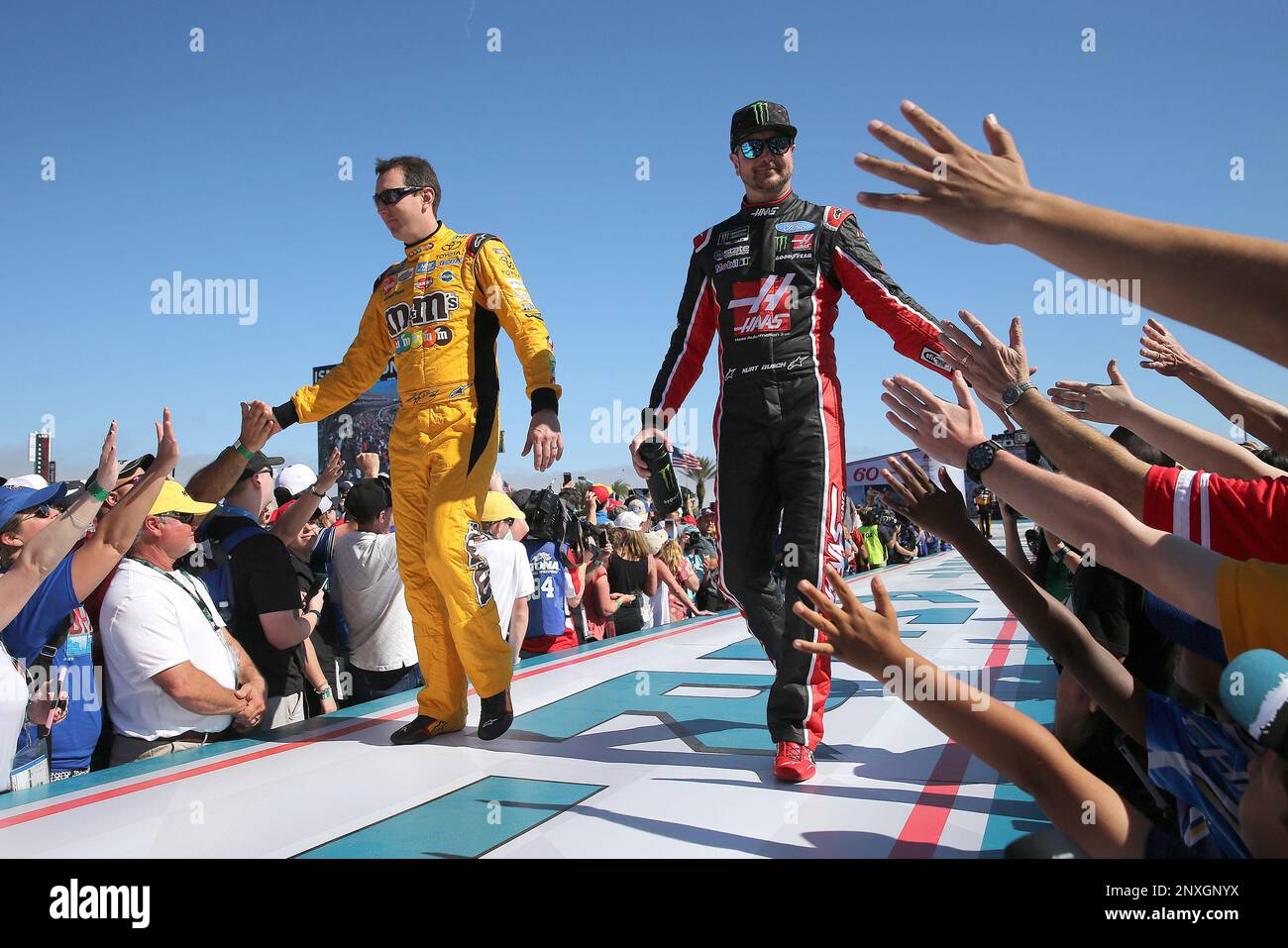 Kyle Busch (L) and brother Kurt Busch are seen during driver ...