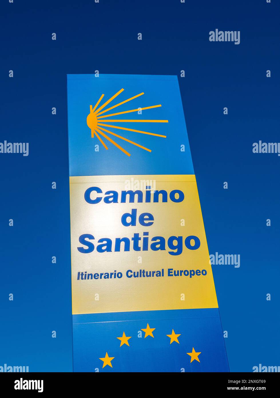 A blue and yellow sign with the iconic Camino de Santiago scallop shell ...