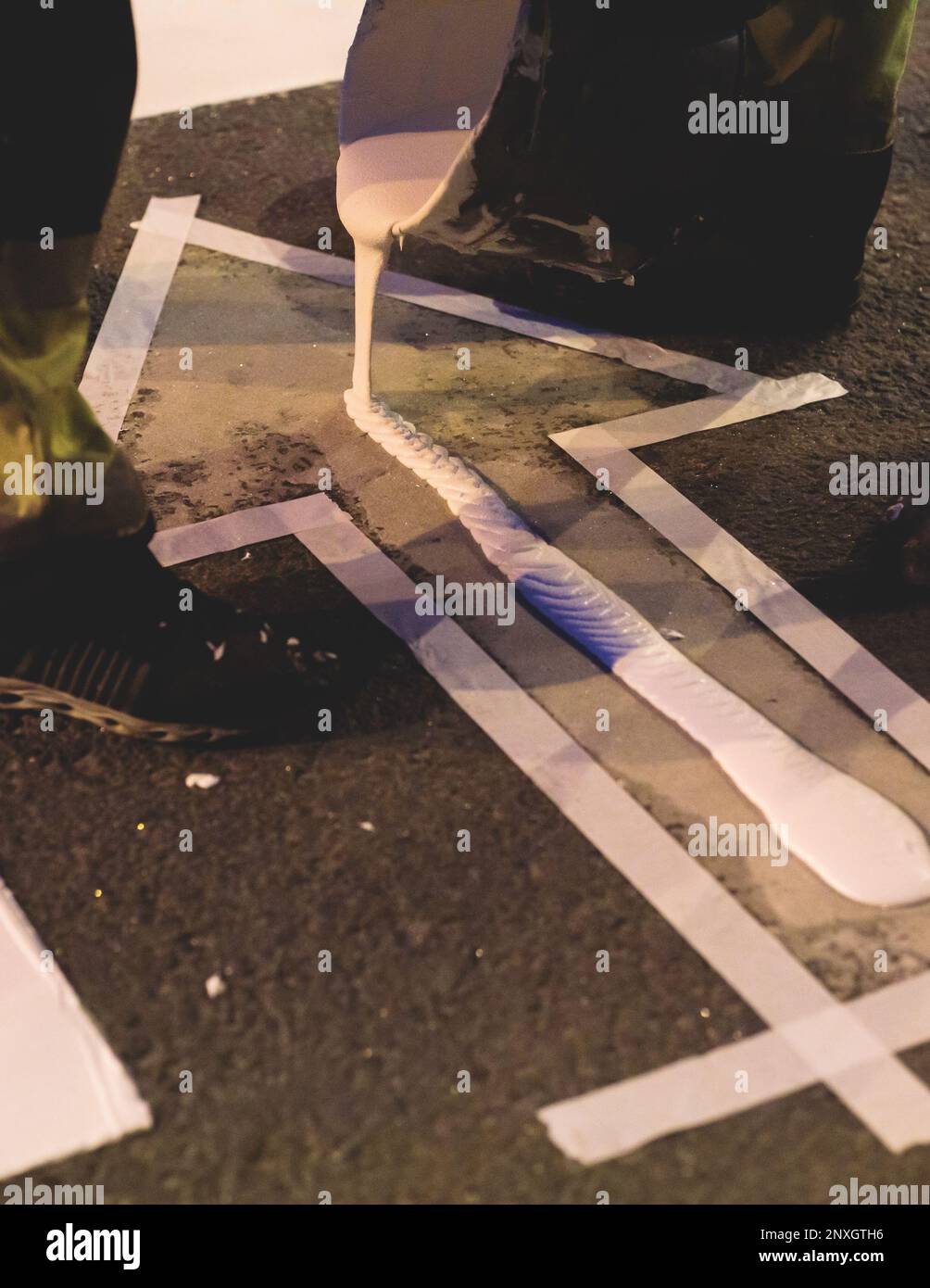 Process of making new road surface markings with a line striping ...