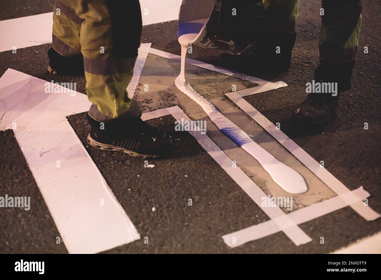 Process of making new road surface markings with a line striping ...