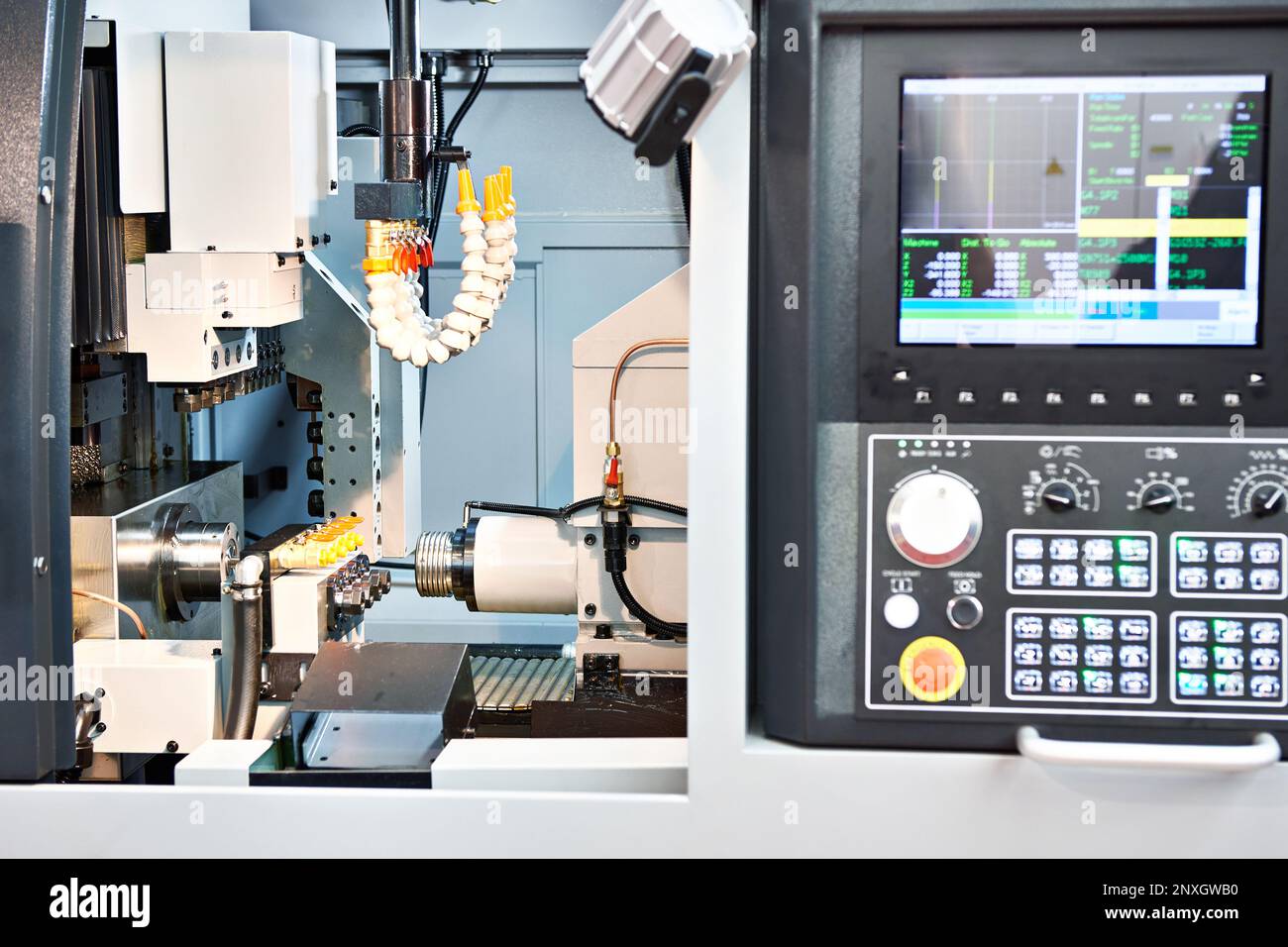 Automatic Lathe CNC with longitudinal turning Stock Photo - Alamy
