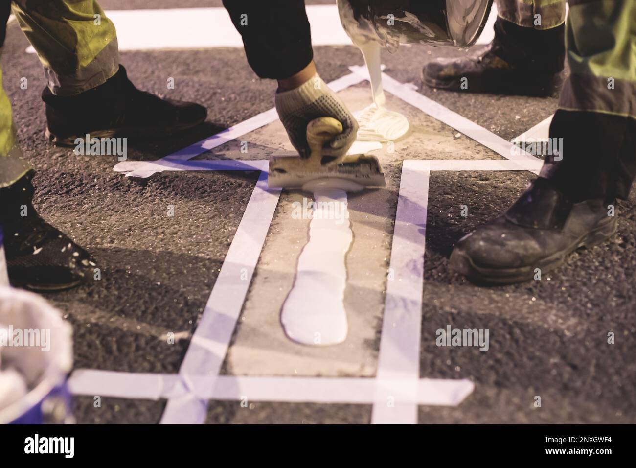 Process of making new road surface markings with a line striping ...