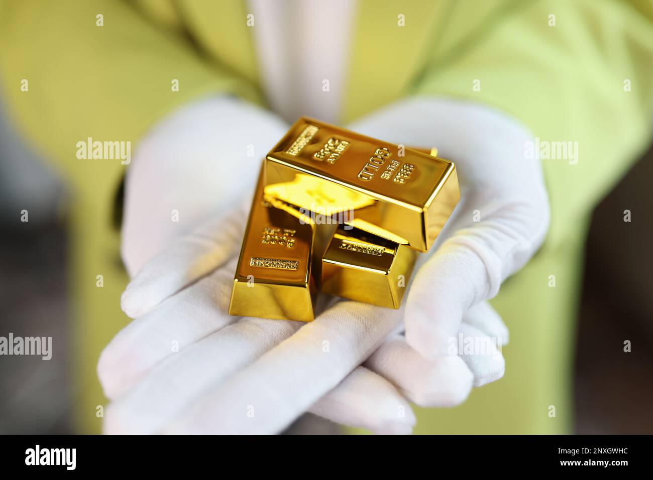 Gold bars in hand hi-res stock photography and images - Alamy