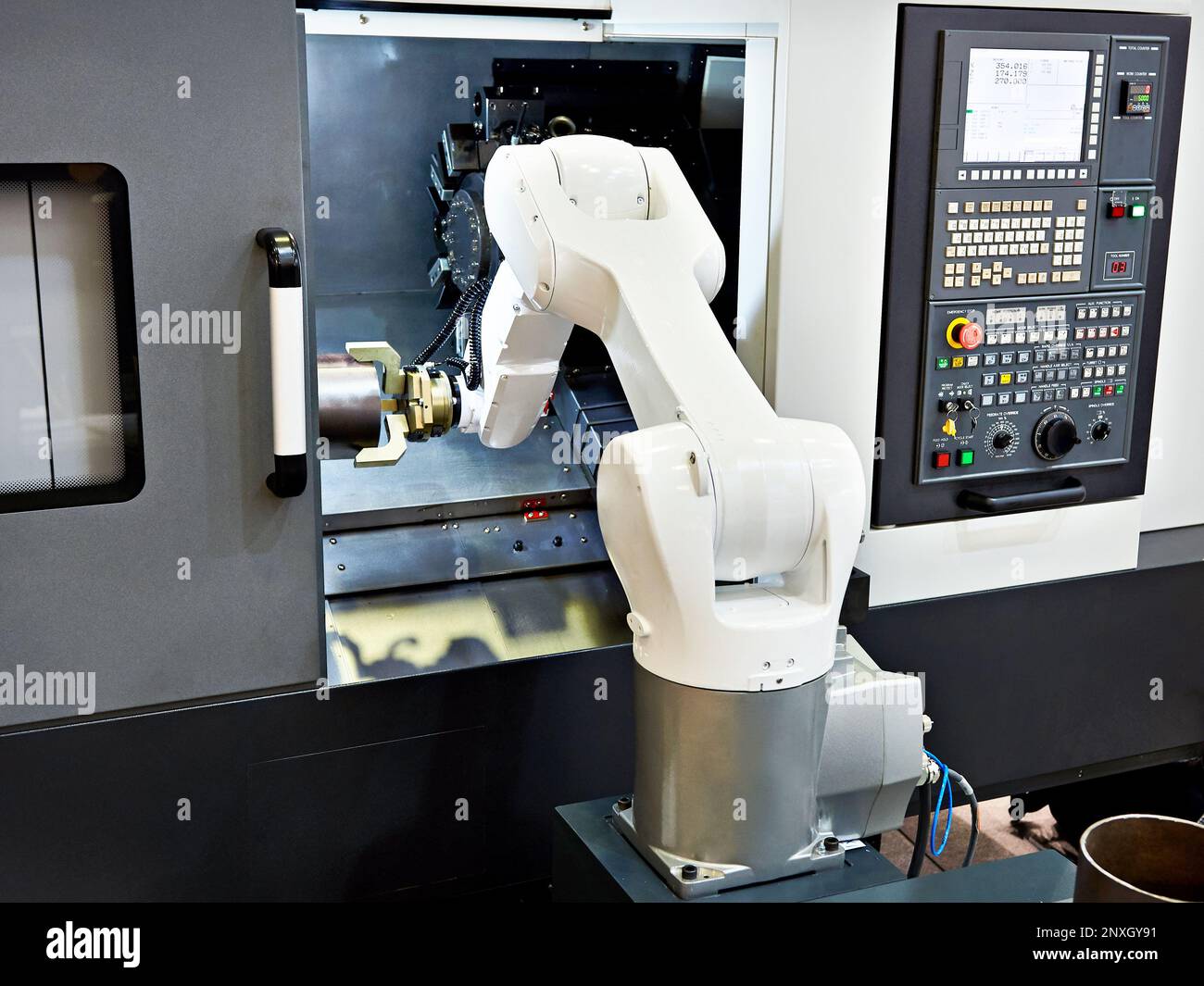 Universal industrial robotic arm and cnc lathe machine Stock Photo - Alamy