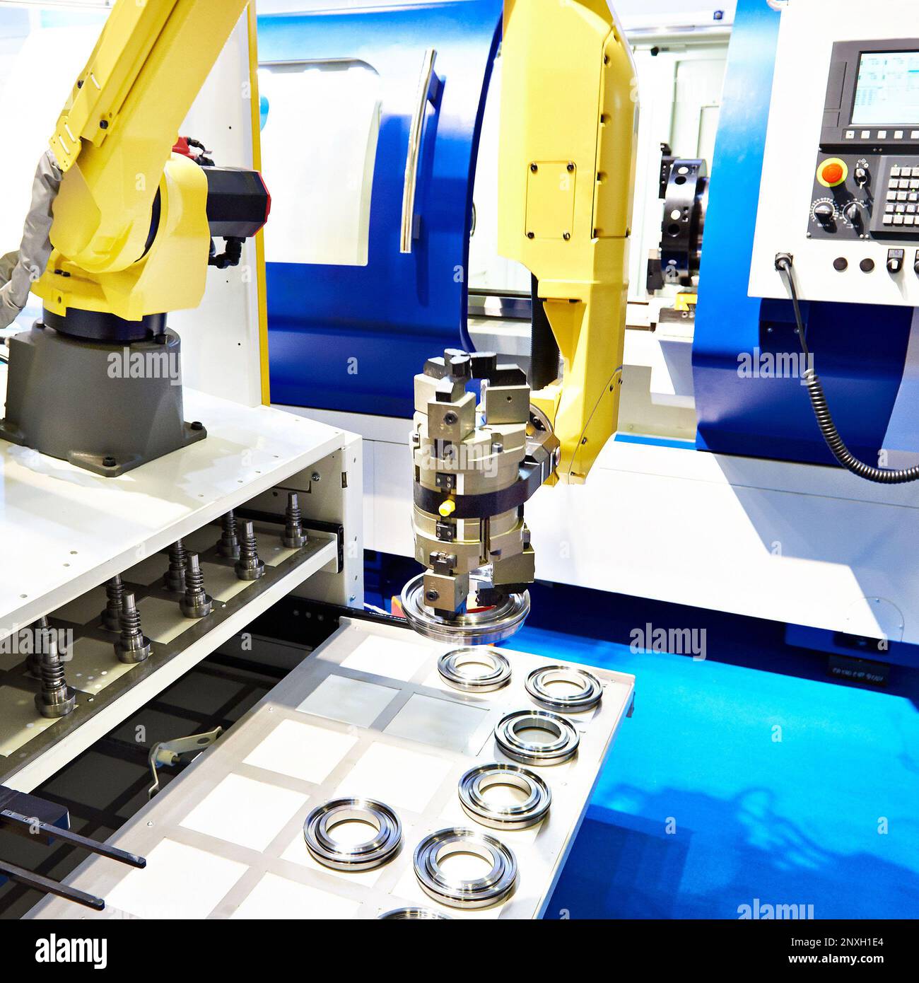 Robotic arm and cnc lathe machine Stock Photo - Alamy
