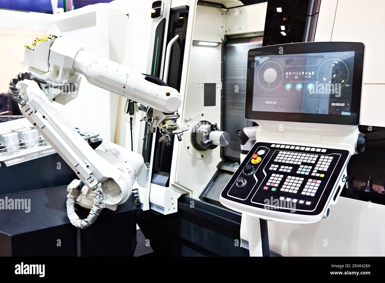 Robotic arm and cnc lathe machine Stock Photo - Alamy