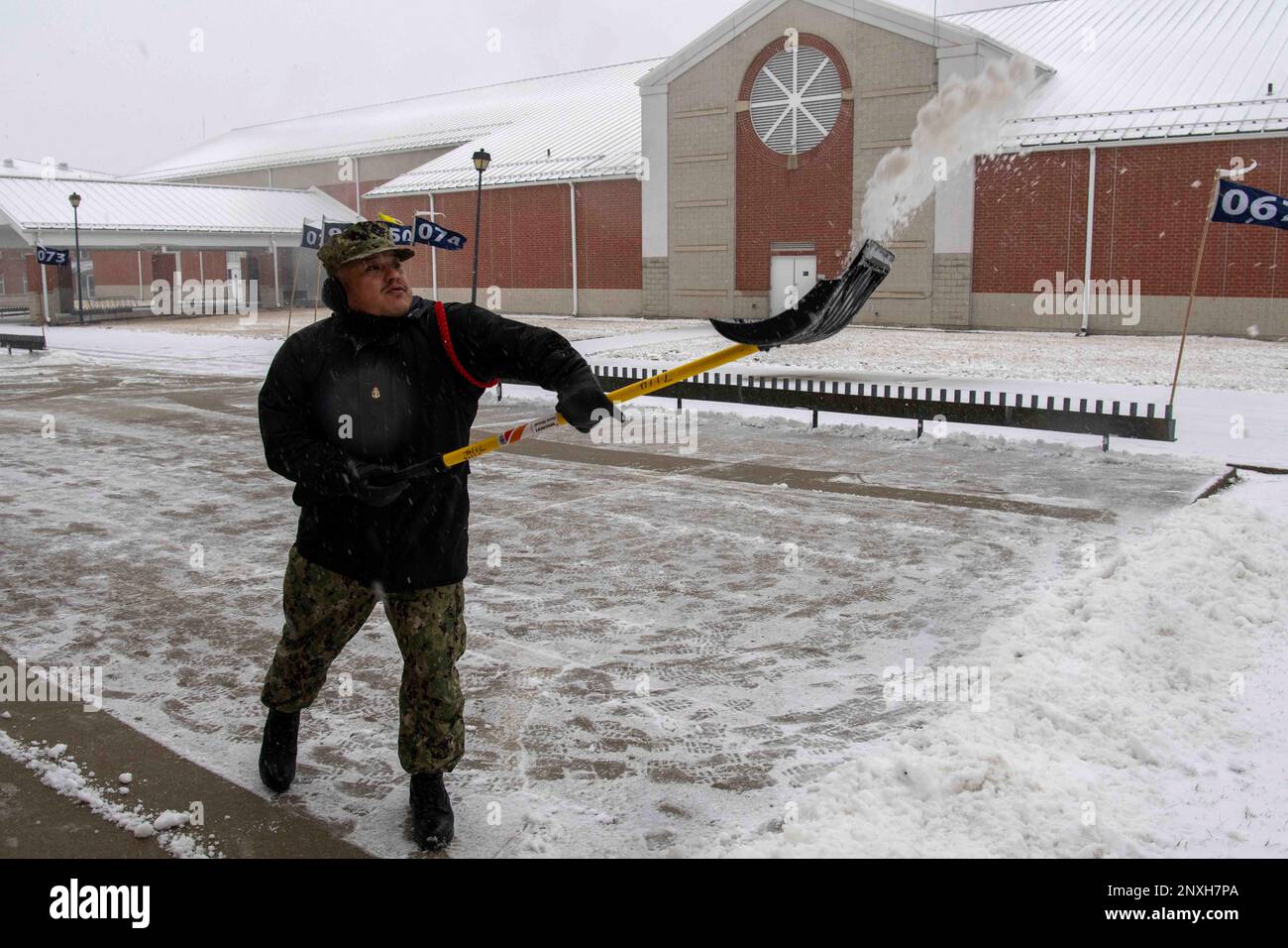 Recruit Division Commanders shovel snow off the grinder at Recruit ...