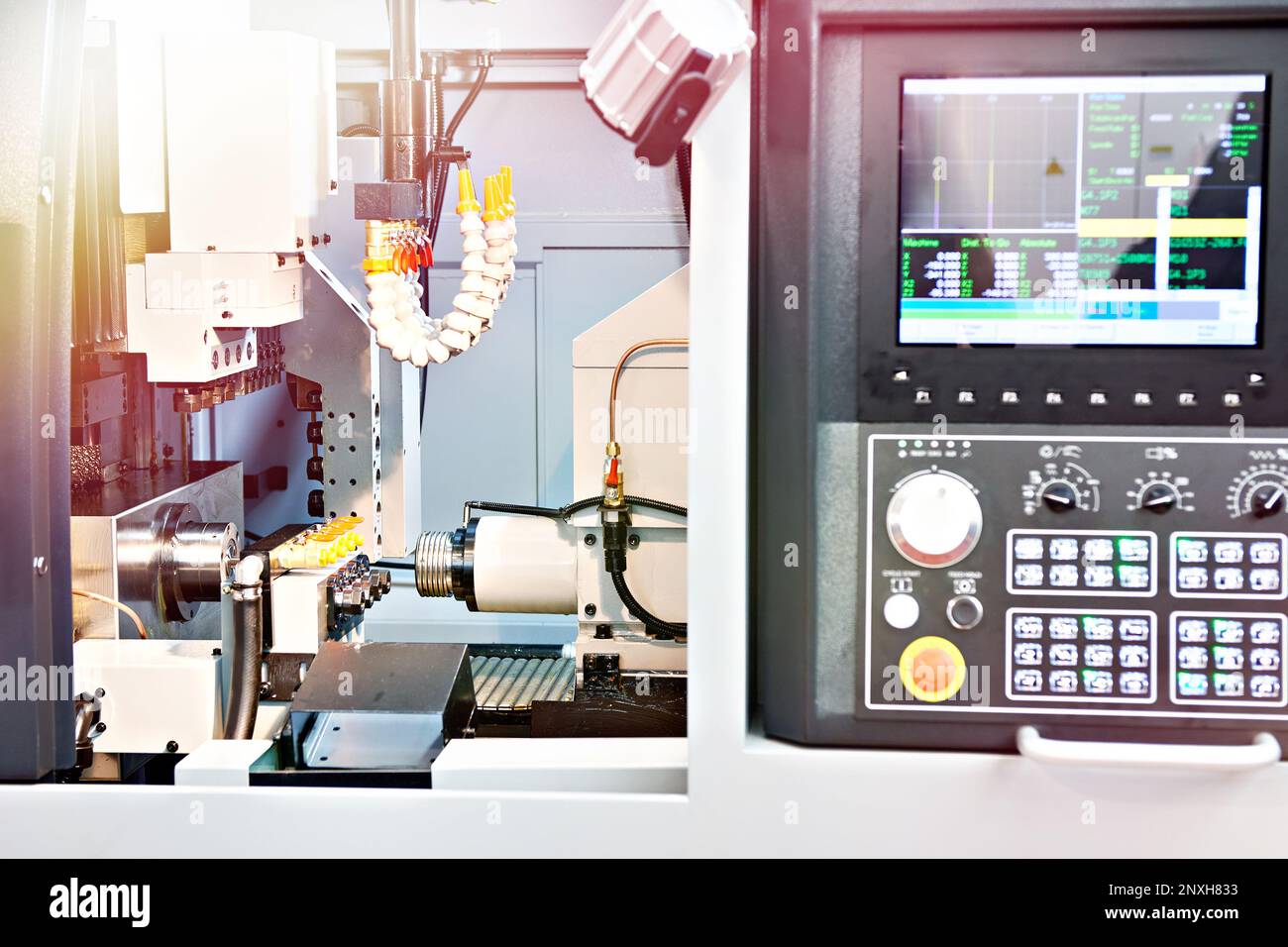 Automatic Lathe CNC with longitudinal turning Stock Photo - Alamy
