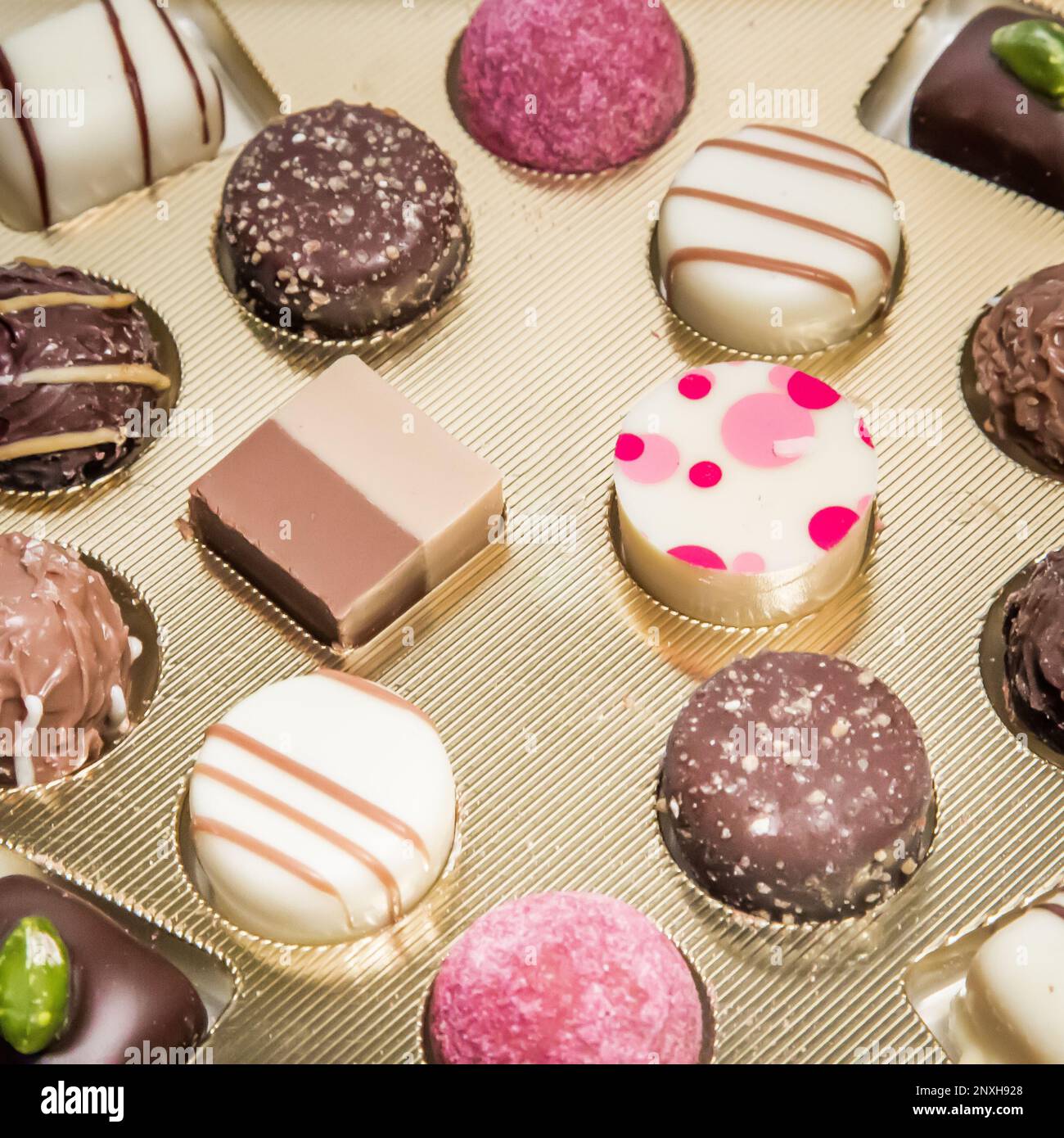 Assortment sweet confectionery chocolate candies and mini pralines on ...