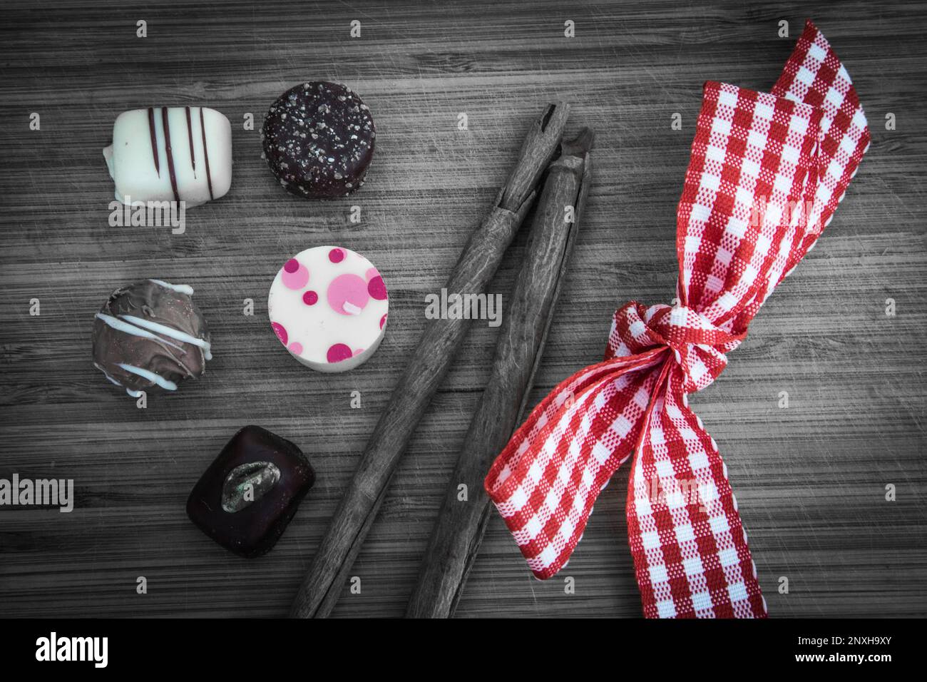 Sweet confectionery in black and white color designed with pink and red ...