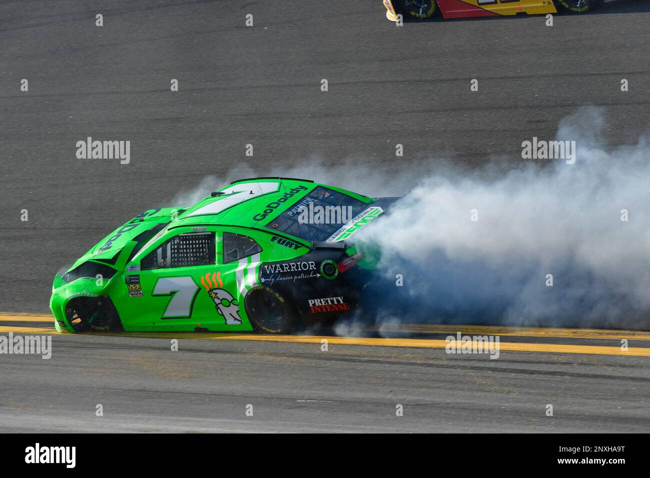 Danica Patrick (7) shows damage following a crash during the Monster ...