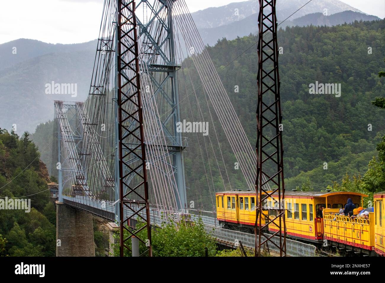 Petit train jaune train in the suspension bridge at Pont Gisclard ...