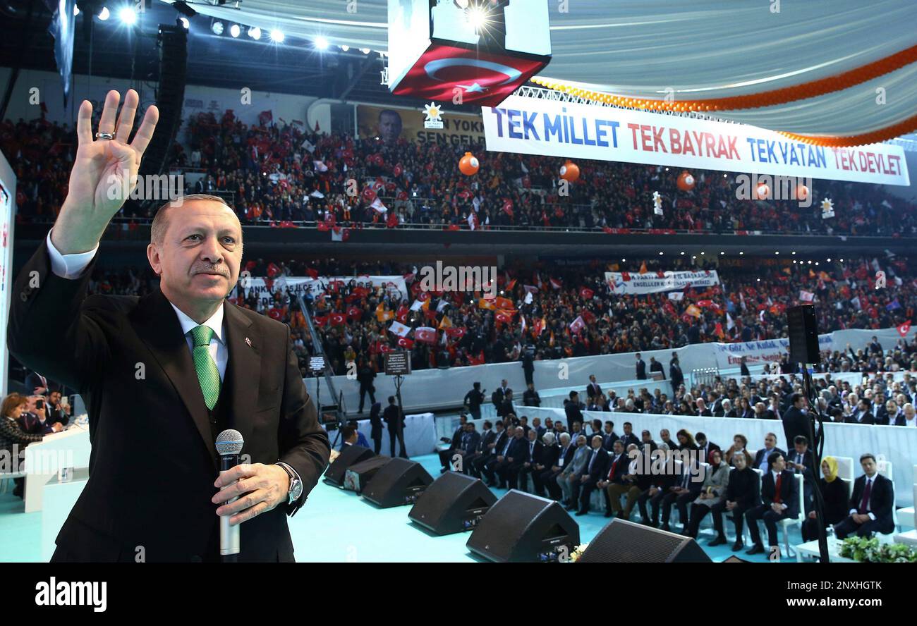 Turkey's President Recep Tayyip Erdogan salutes the members of his ...