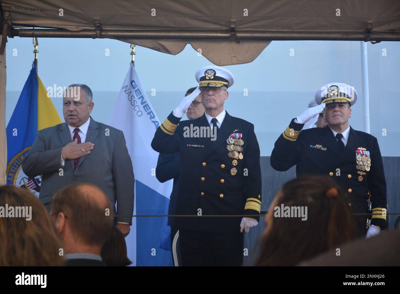 The Honorable Carlos Del Toro, Secretary of the Navy (left) and Rear Adm. Michael Wettlaufer ...
