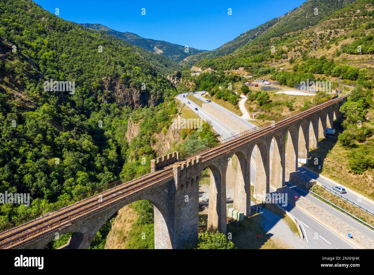 Aerial view of The Yellow Train or Train Jaune on Sejourne bridge ...