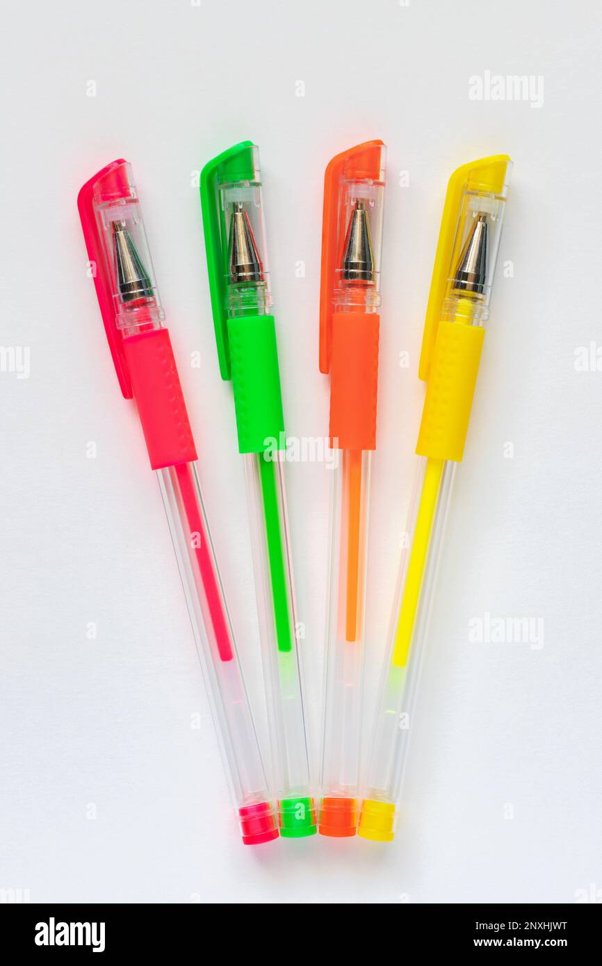 Colorful neon colors gel pens on white background Stock Photo - Alamy