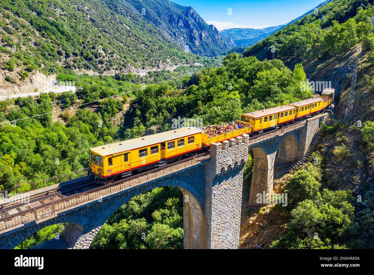 Aerial view of The Yellow Train or Train Jaune on Sejourne bridge ...